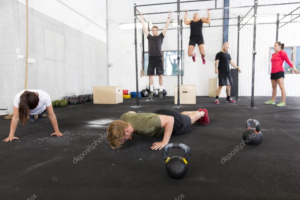 Workout group does exercises at fitness gym — Stock Photo © kjekol ...
