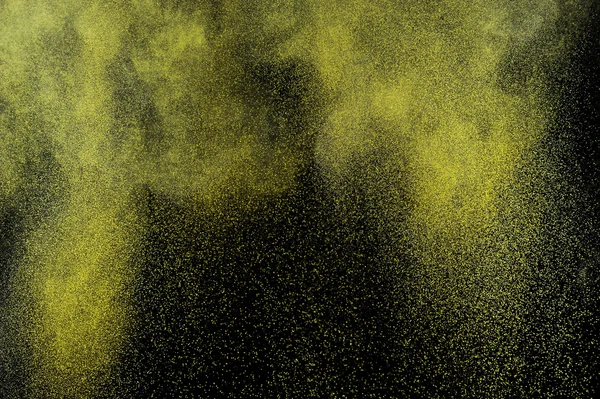 Gold powder explosion on black background. - Stock Image - Everypixel