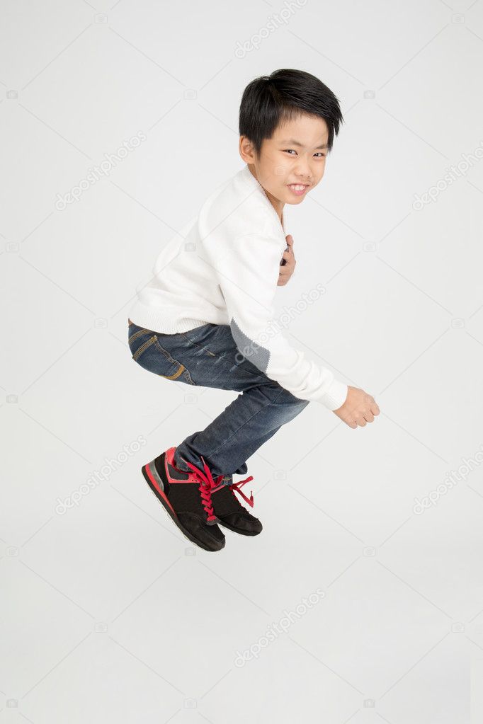Asian cute boy is jumping with smile face Stock Photo by ©sirikornt ...