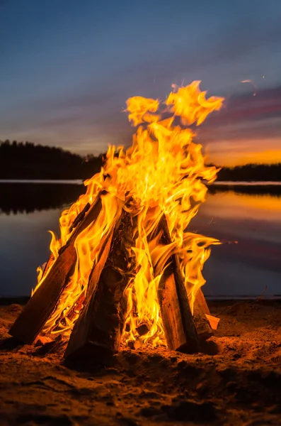 Bonfire on the beach sand Stock Photo by ©yuratosno 67158331