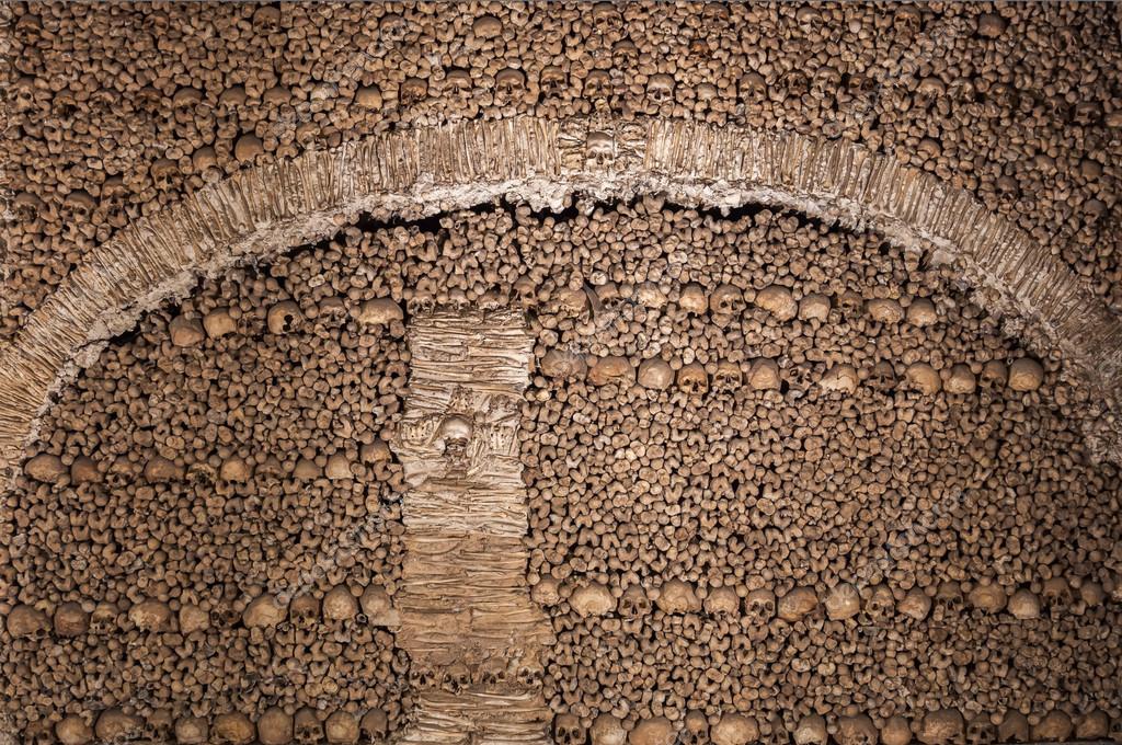 The wall made of human bones and skulls — Stock Photo © mkos83 #69384621