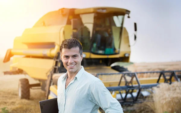Agricultural engineer on wheat harvest - Stock Image - Everypixel