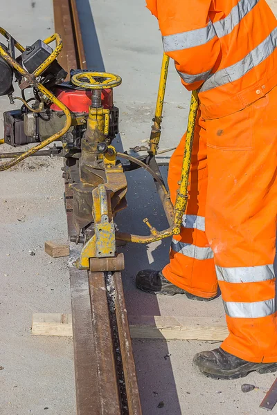Tramway track construction worker with rail grinding machine 2 — Stock ...