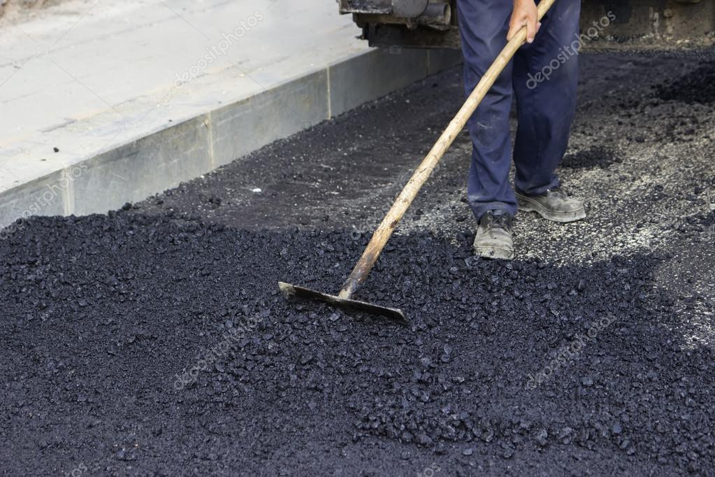 Worker hand with asphalt rake 2 — Stock Photo © kataklinger #78125530