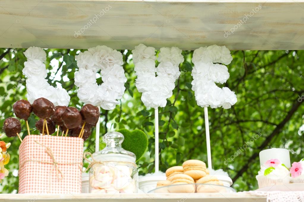 Wedding feast. Banquet. Sweets for wedding table.French macaroons.Candy ...