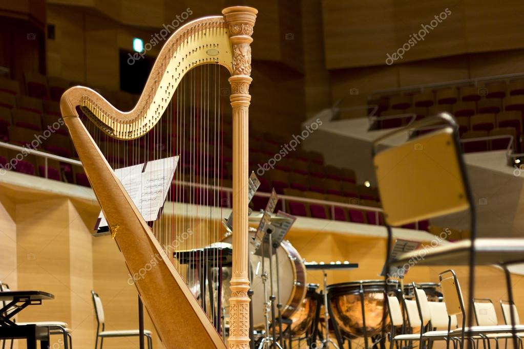 Harp in a large concert hall. Musical instrument.The concert harp ...