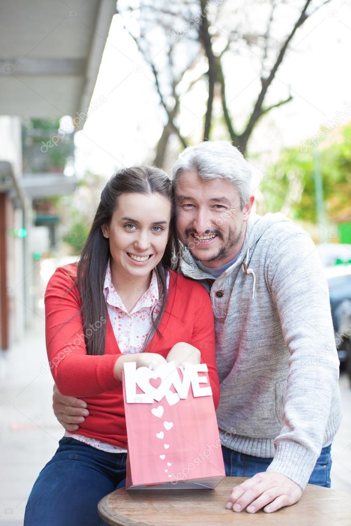 Man surprising woman with present Stock Photo by ©Implementar 102647362