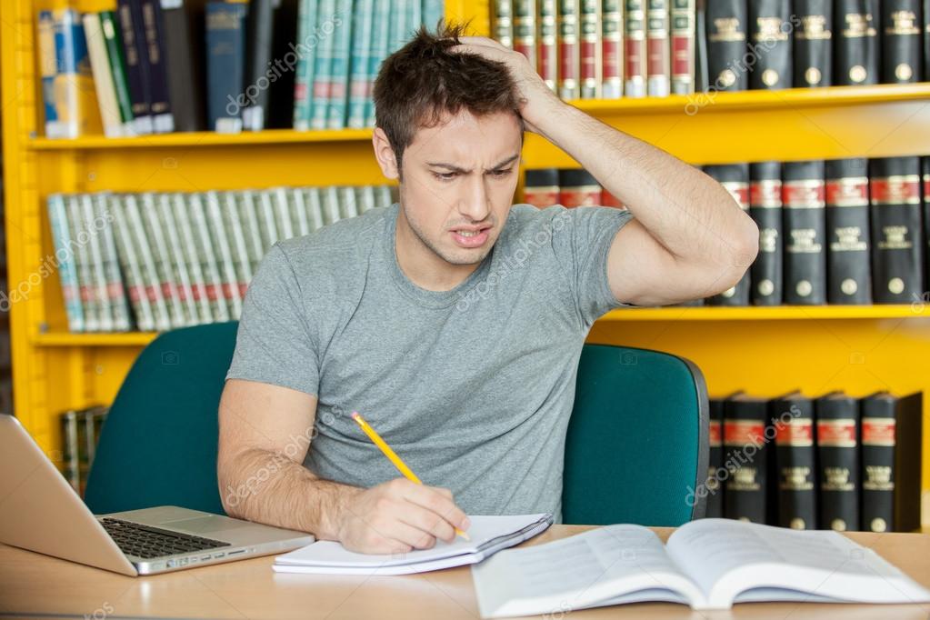 Man studying in library Stock Photo by ©Implementar 84582924 Man studying in library Stock Photo by ©Implementar 84582924