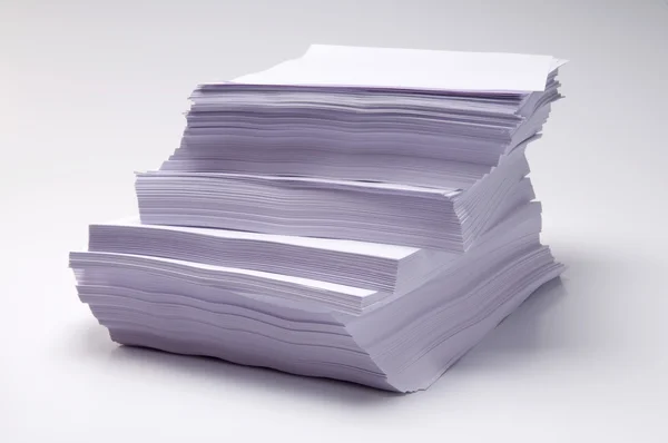 Hand put paper on stack of paper. Stock Photo by ©odua 10671745