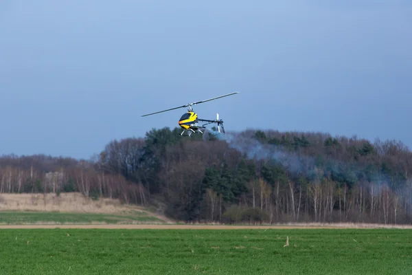 Helicopter hoisting over wind turbine Stock Photos, Royalty Free ...