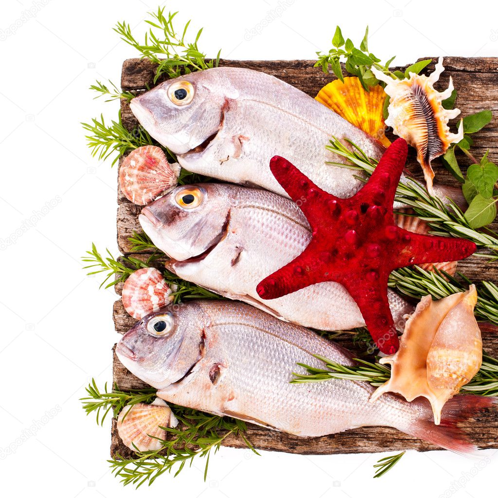 Fresh Caught Raw Fish Shells Wooden Board Stock Photo by ©vanazi 120695264