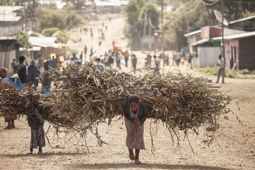 Woman Carrying Heavy Load