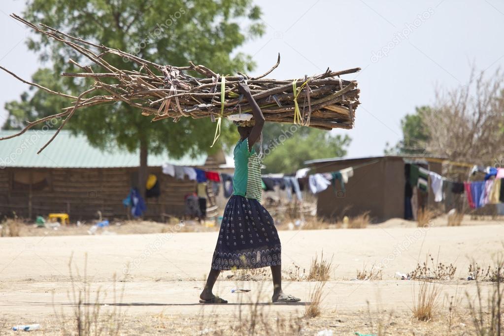 Woman Carrying Heavy Load