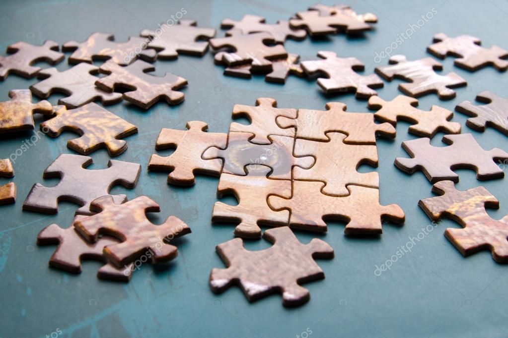 Elements of the puzzle on a green background — Stock Photo ...
