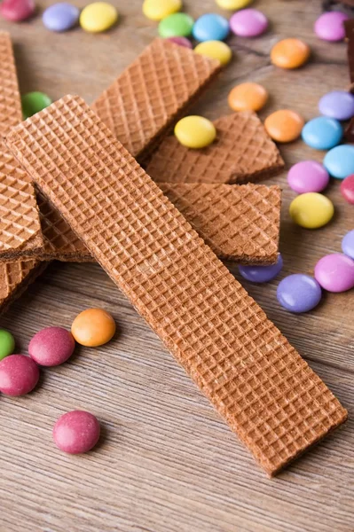 Long chocolate biscuits on heap with sweets — Stock Photo © yommy8008 ...