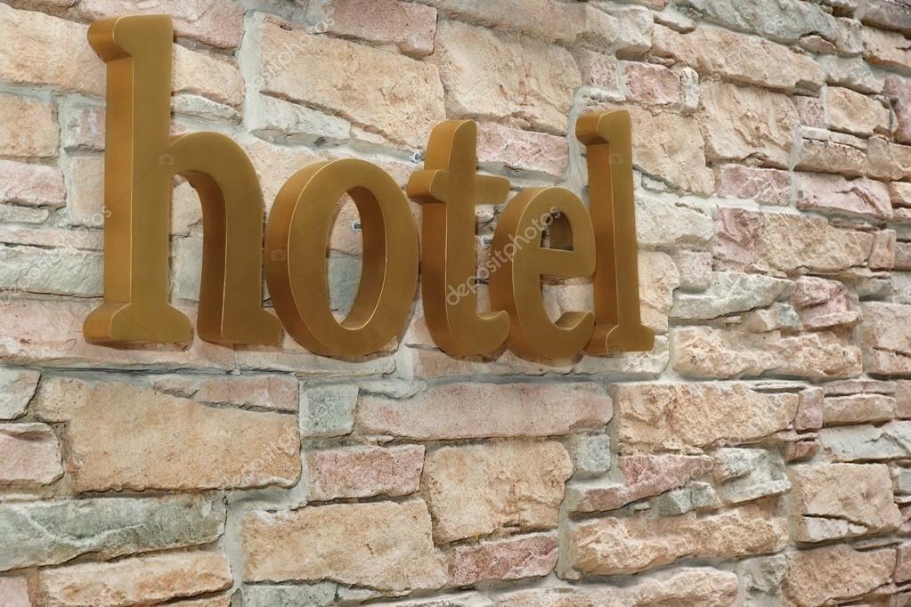 Hotel Sign On Artificial Stone Wall — Stock Photo © aruba2000 #86950864