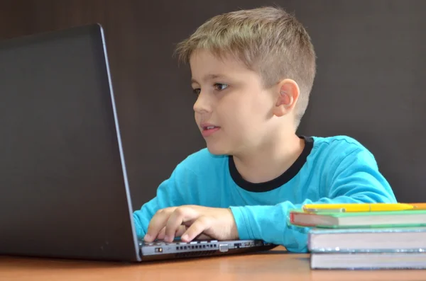 Boy with laptop Stock Photo by ©YuliyaM 72696517