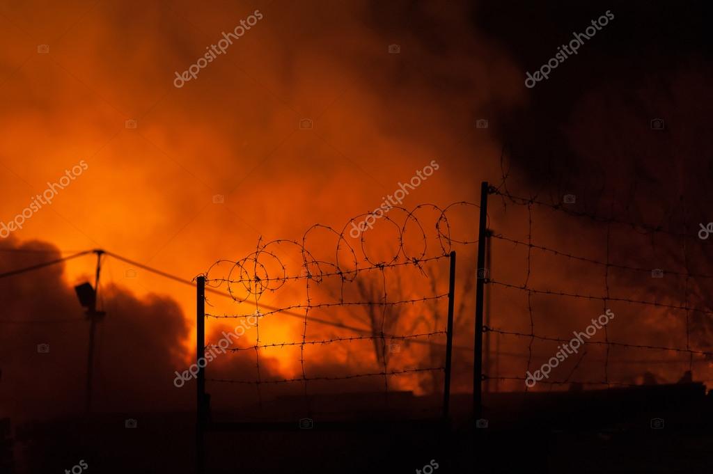 Fences with barbed wire, storage fire Stock Photo by ©160275 103770856