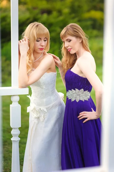 Bride and bridesmaid outside - Stock Image - Everypixel