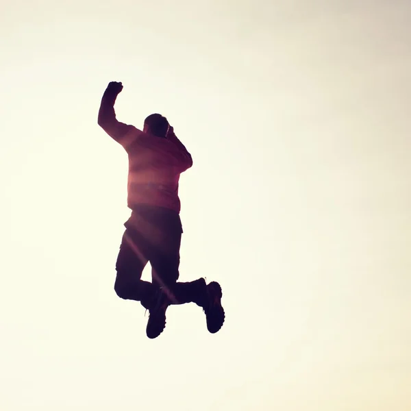 Flying man. Young man falling down on sky background. Stock Photo by ...