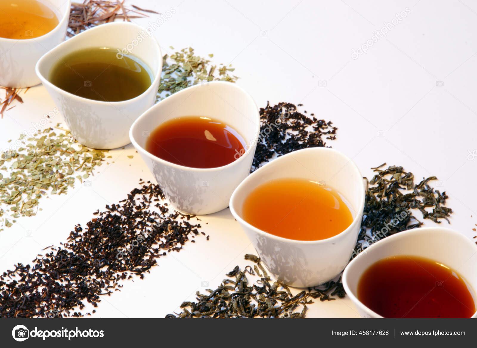 Selection of different types of loose tea brewed in small cups Stock ...