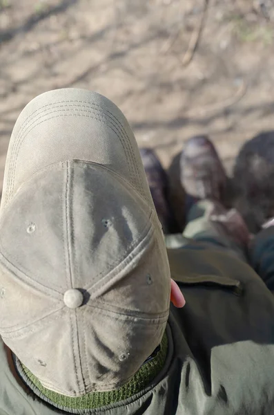Overhead view of a man in military uniform. A soldier in a green cap ...
