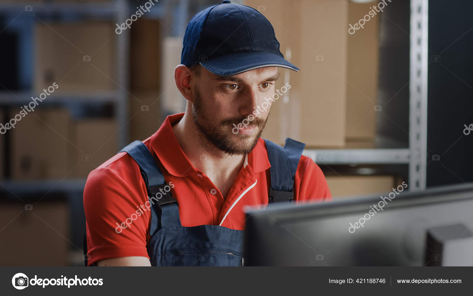 Portrait of Uniformed Worker Using Personal Computer while Sitting at ...