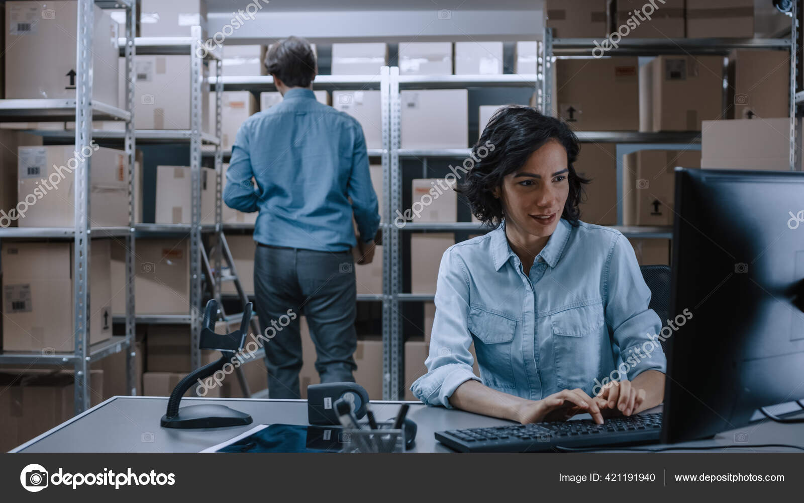 Female Inventory Manager Sitting at Her Desk and Using Personal ...