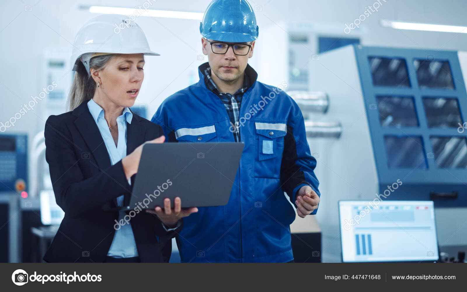 Female Manager and Project Engineer Wearing Hardhats Use Laptop in ...