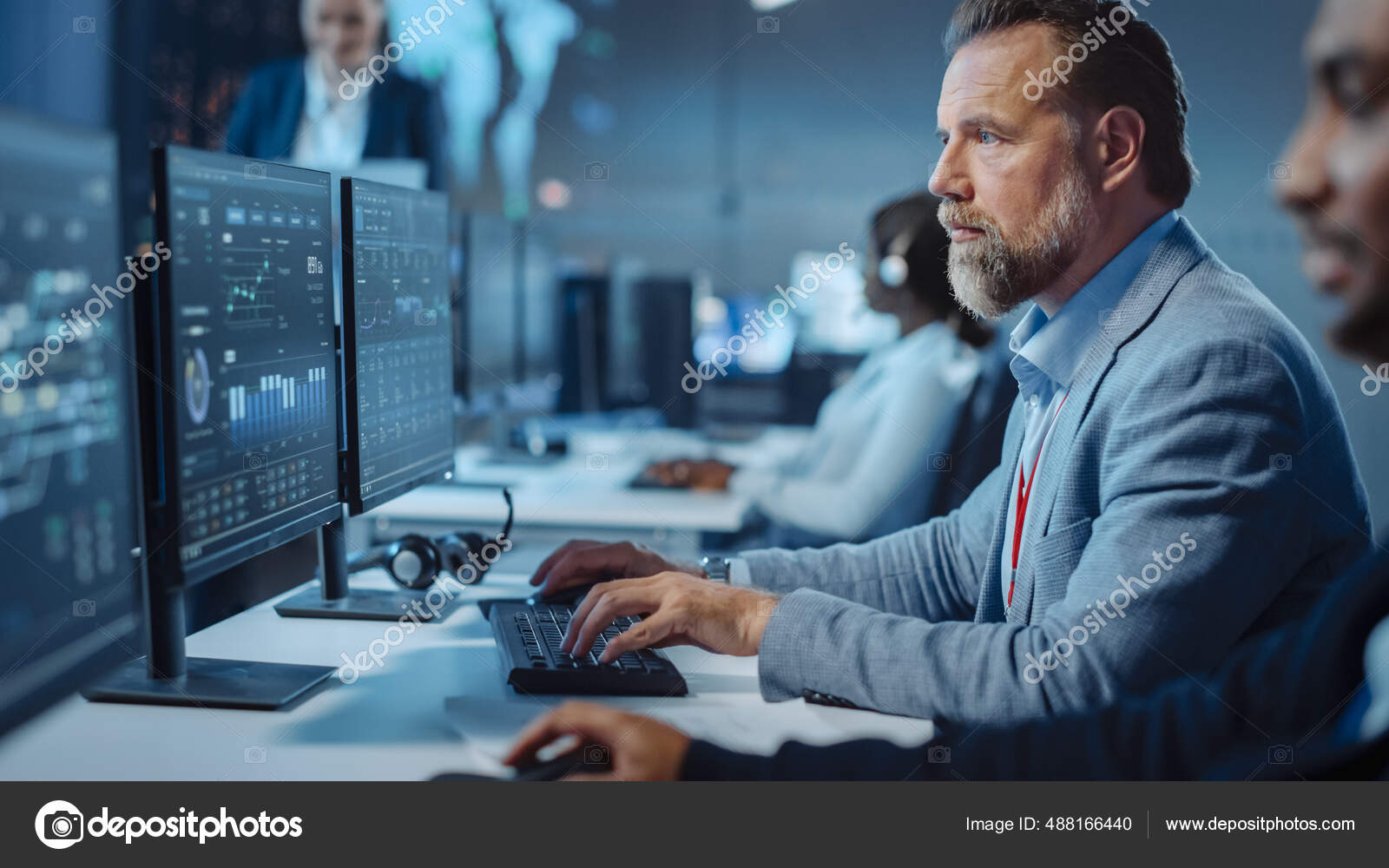 Portrait of Serious Professional Technical Controller Sitting at His ...