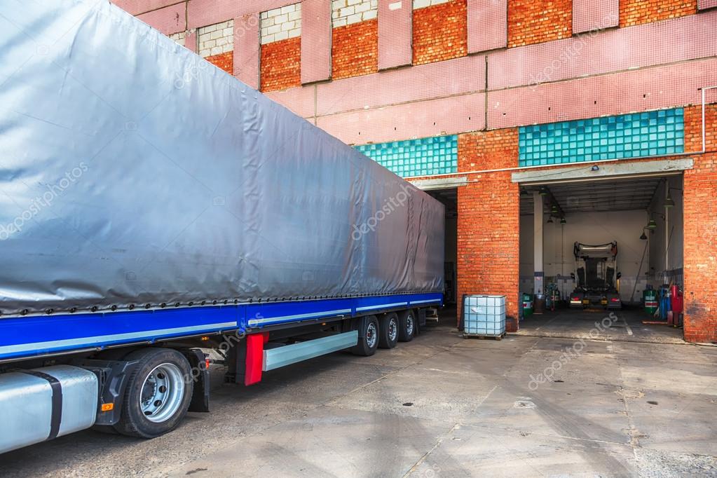 Truck or lorry repair shop service Stock Photo by ©xmagic 64096207