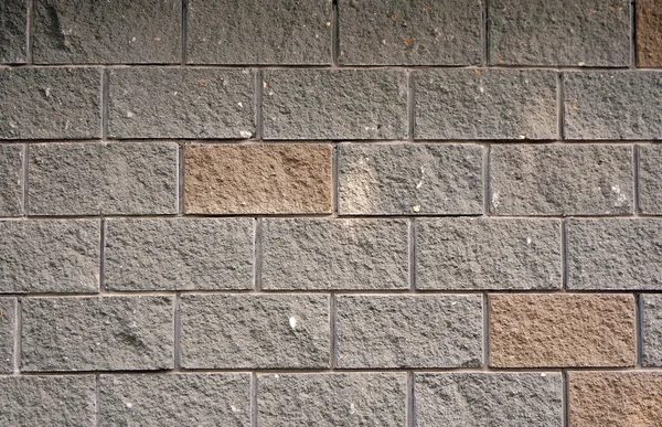 The wall of the large gray and red rectangular stones as backgro ...