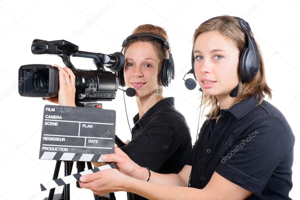 Two pretty young women work with a video camera — Stock Photo ...