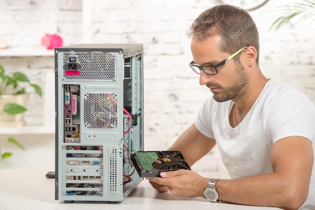 Young engineer repaired a computer — Stock Photo © philipimage #78814942