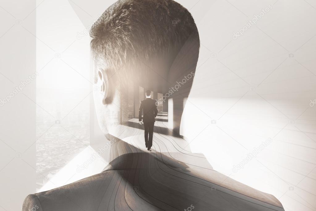 Back view of thinking and walking businessmen on city background ...