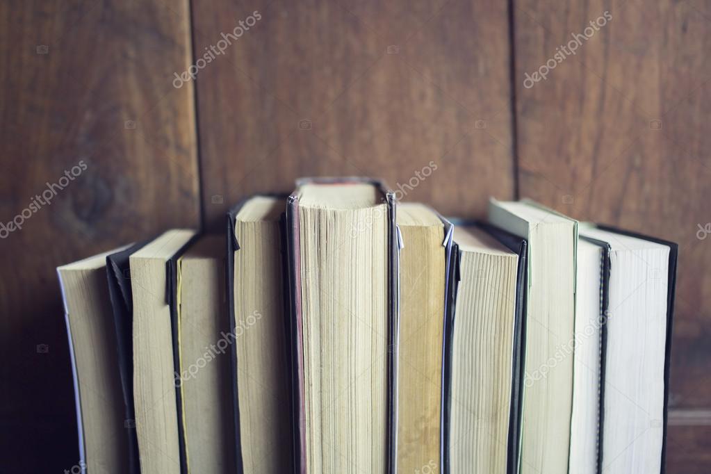 Stack of books in bookcase Stock Photo by ©peshkov 85758590