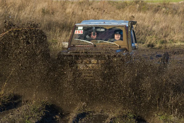 Unknown rider on the off-road vehicle overcomes a route - Stock Image ...