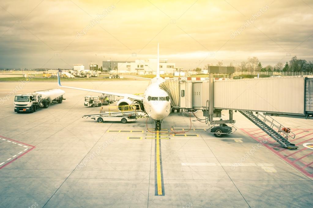 Modern airplane at the terminal gate ready for takeoff - International ...