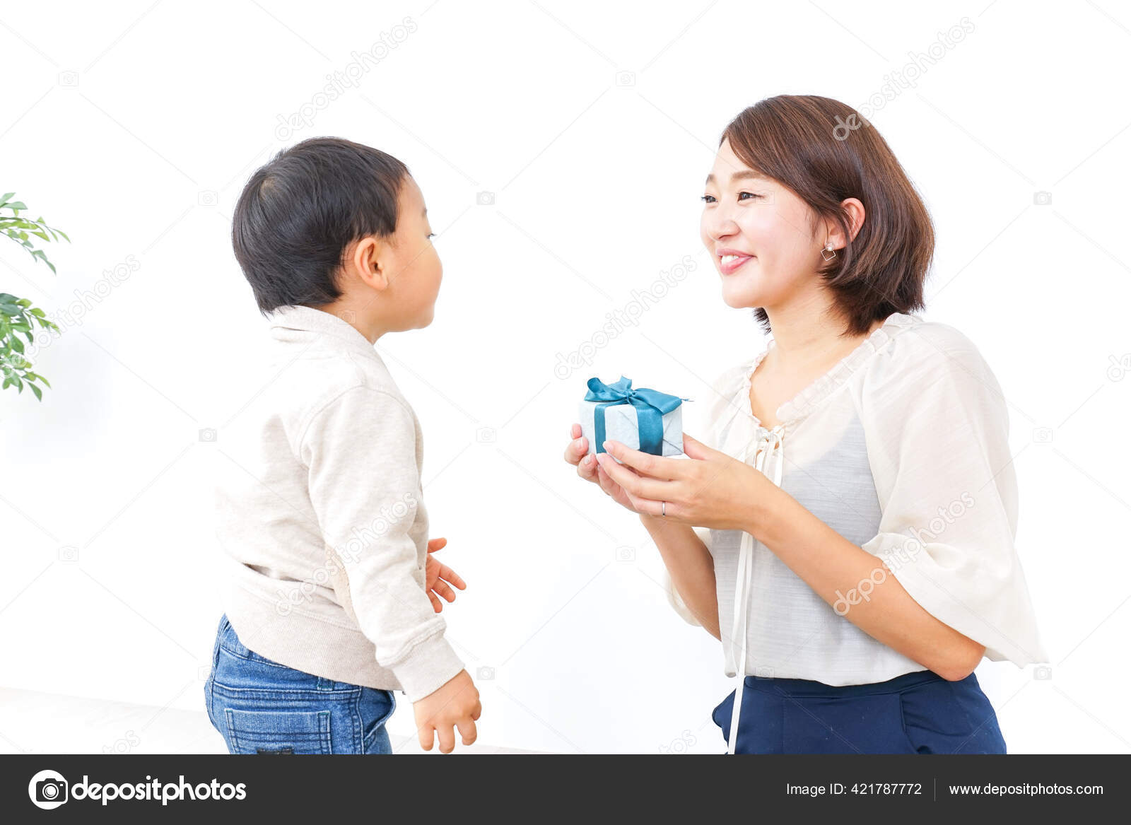 Child Giving Mother Present Stock Photo by ©maroke 421787772