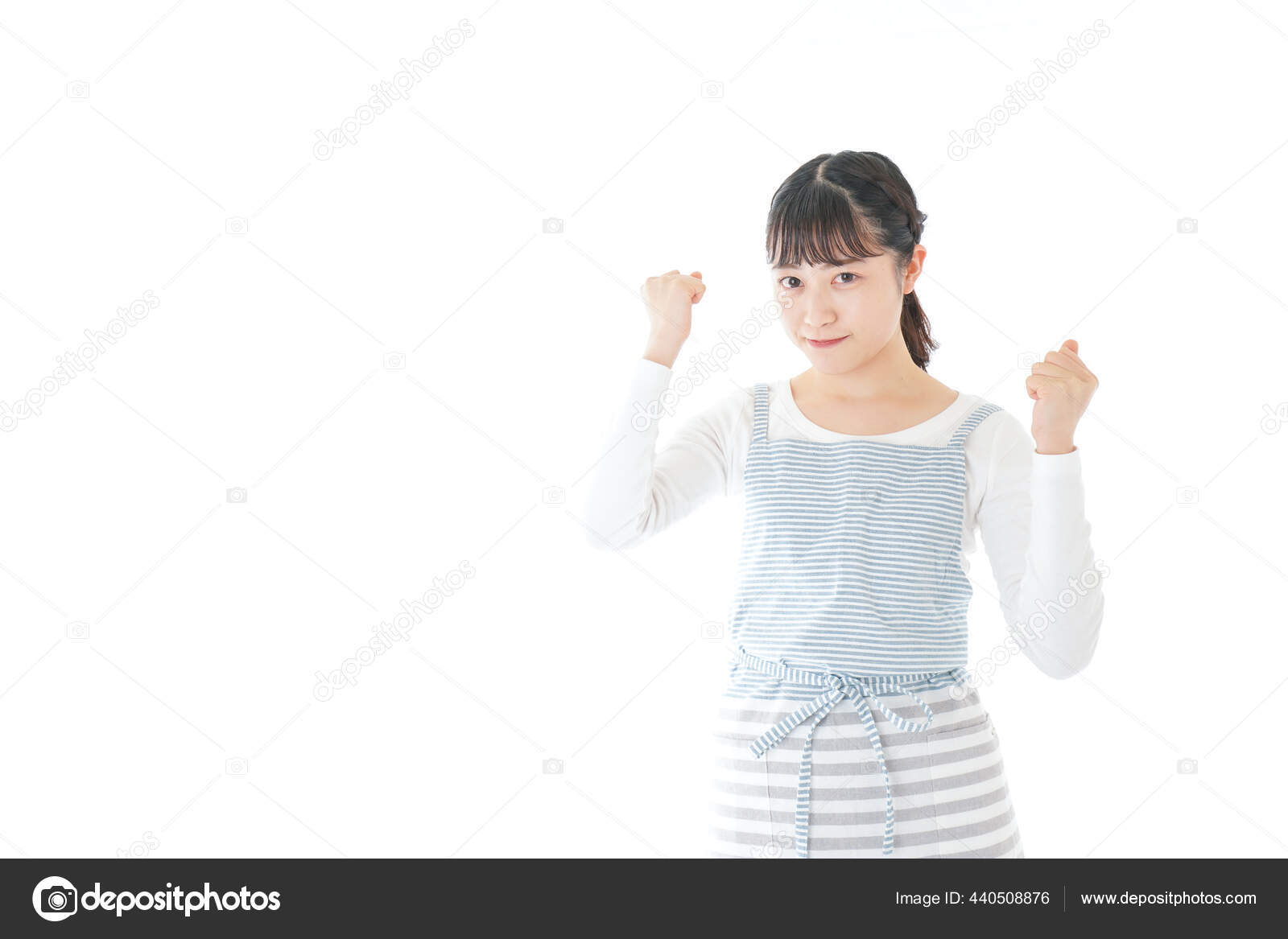 Young Woman Giving Guts Pose — Stock Photo © maroke #440508876