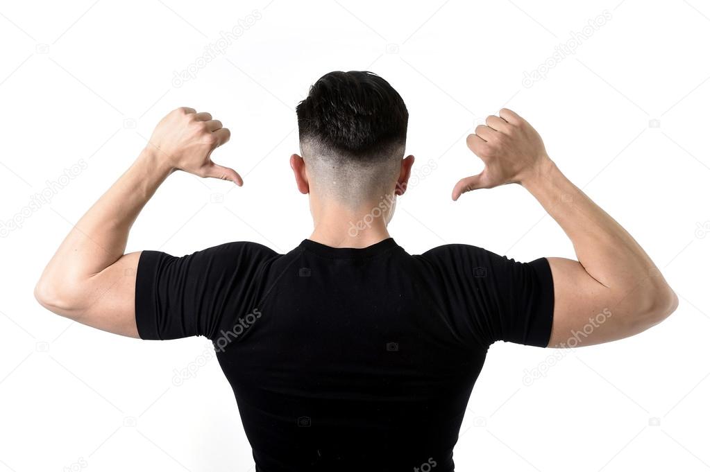 Attractive sport man pointing on his black t-shirt with copy sp — Stock ...