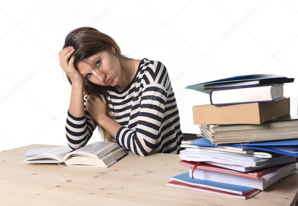 Young stressed student girl studying and preparing MBA test exam in ... Young stressed student girl studying and preparing MBA test exam in ...