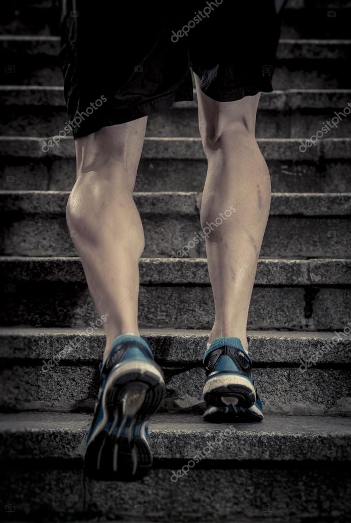 Young athletic legs with sharp scarf muscles of runner sport man ...