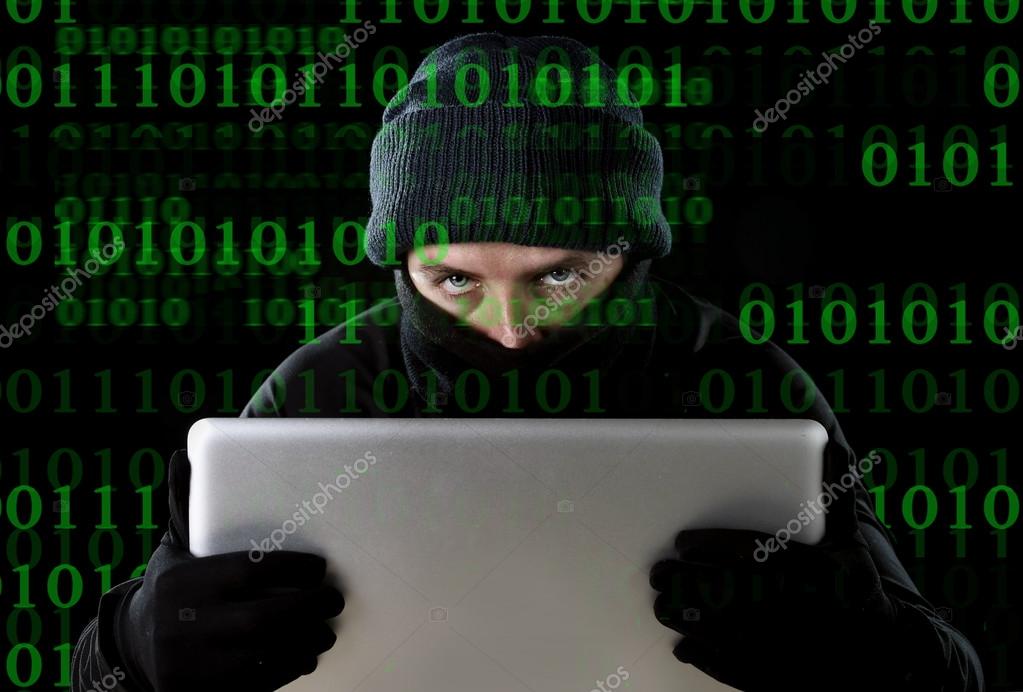 Hacker man in black using computer laptop for criminal activity hacking ...