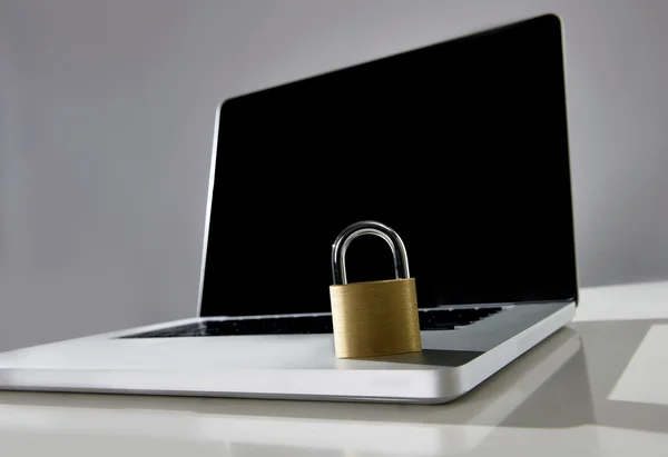 lock on keyboard of computer laptop with blank black screen as copy ...