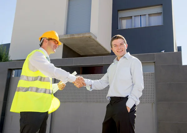 happy customer smiling and constructor foreman worker handshake ...