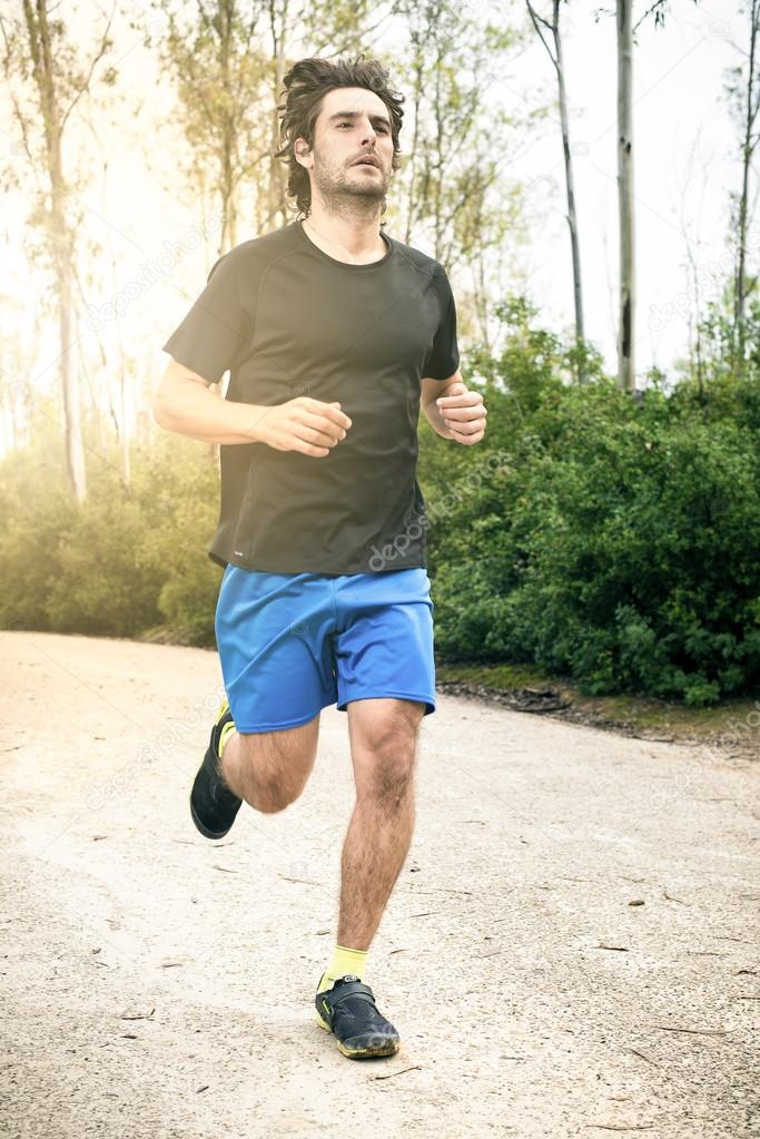 Man running in the park Stock Photo by ©kiko_jimenez 58751795