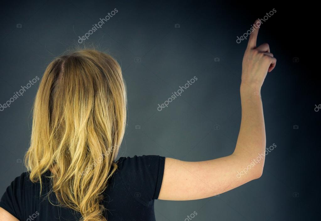 Woman back pointing by finger Stock Photo by ©Bruno135 111376742