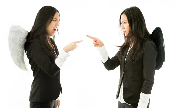 Angry devil side of a young Asian businesswoman punching the white ...