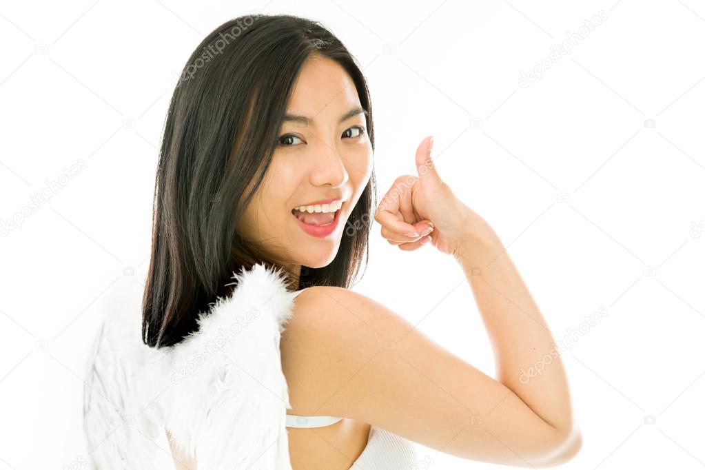 Angel side of a young Asian woman turning back and showing thumbs up ...